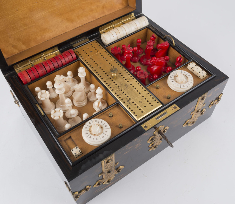 An impressive antique games box, coromandel and satinwood with brass ...
