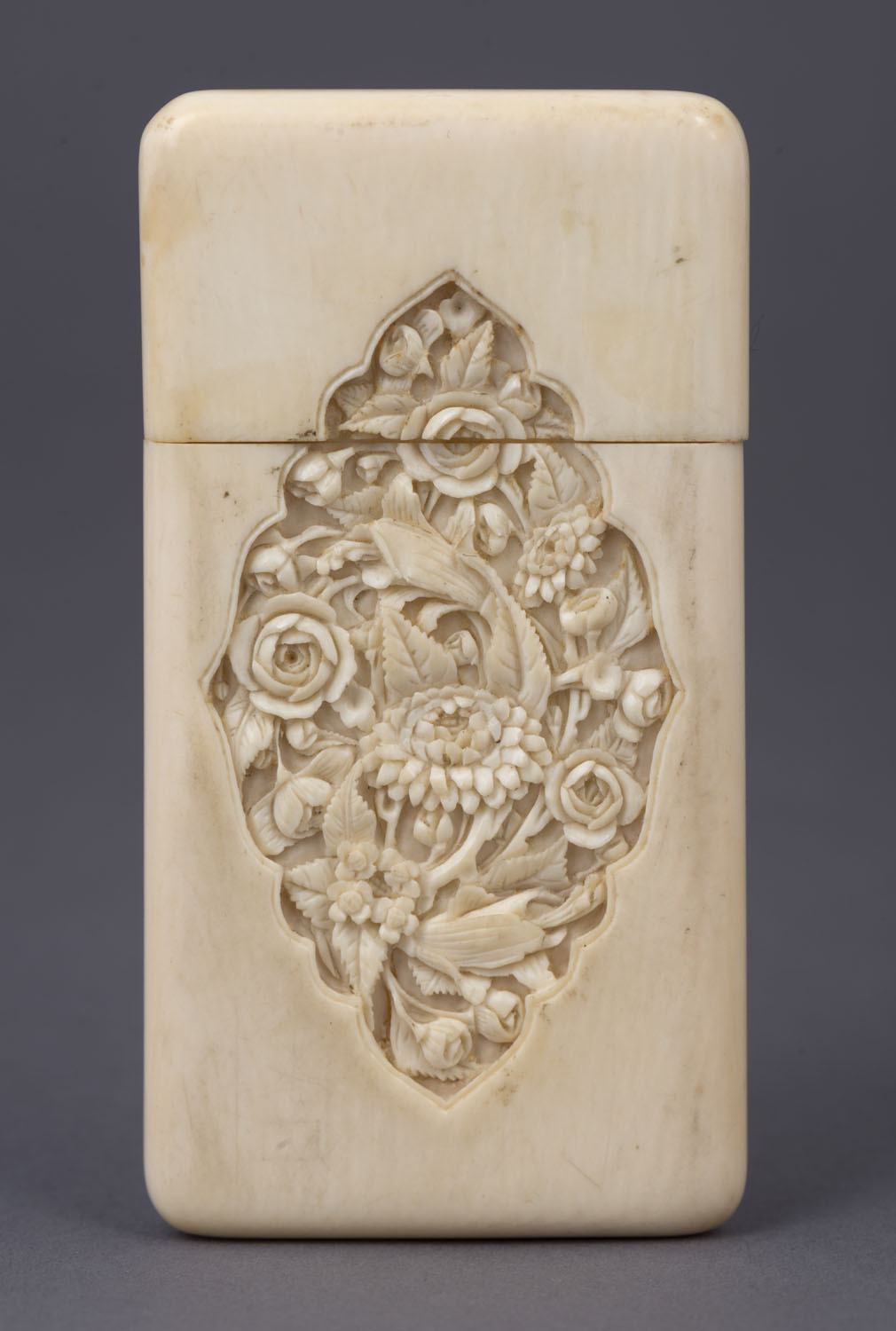 A Chinese carved ivory calling card case, late 19th century, 9cm high
