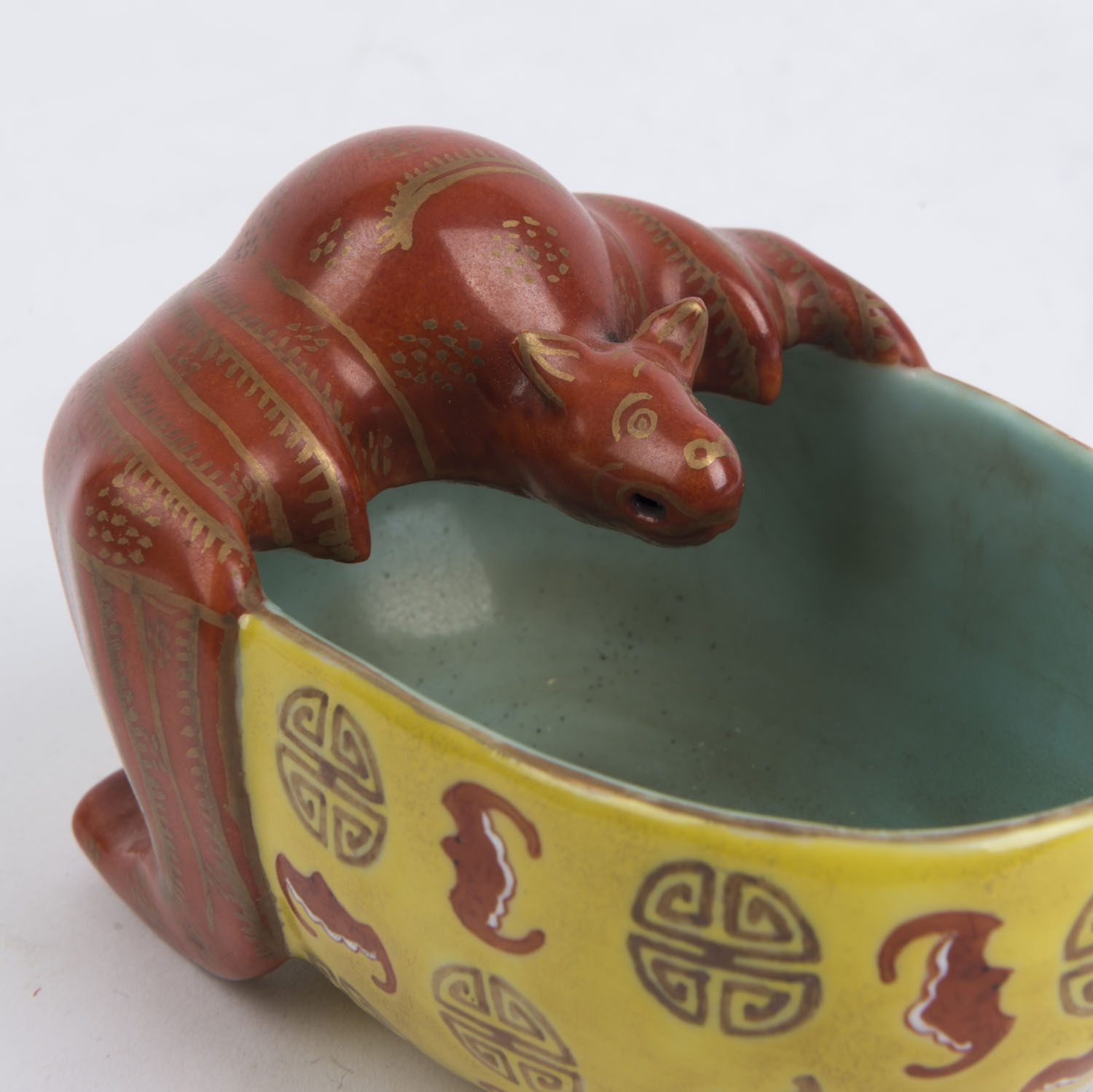 An antique Chinese porcelain washer in the form of a bat with Wan ...