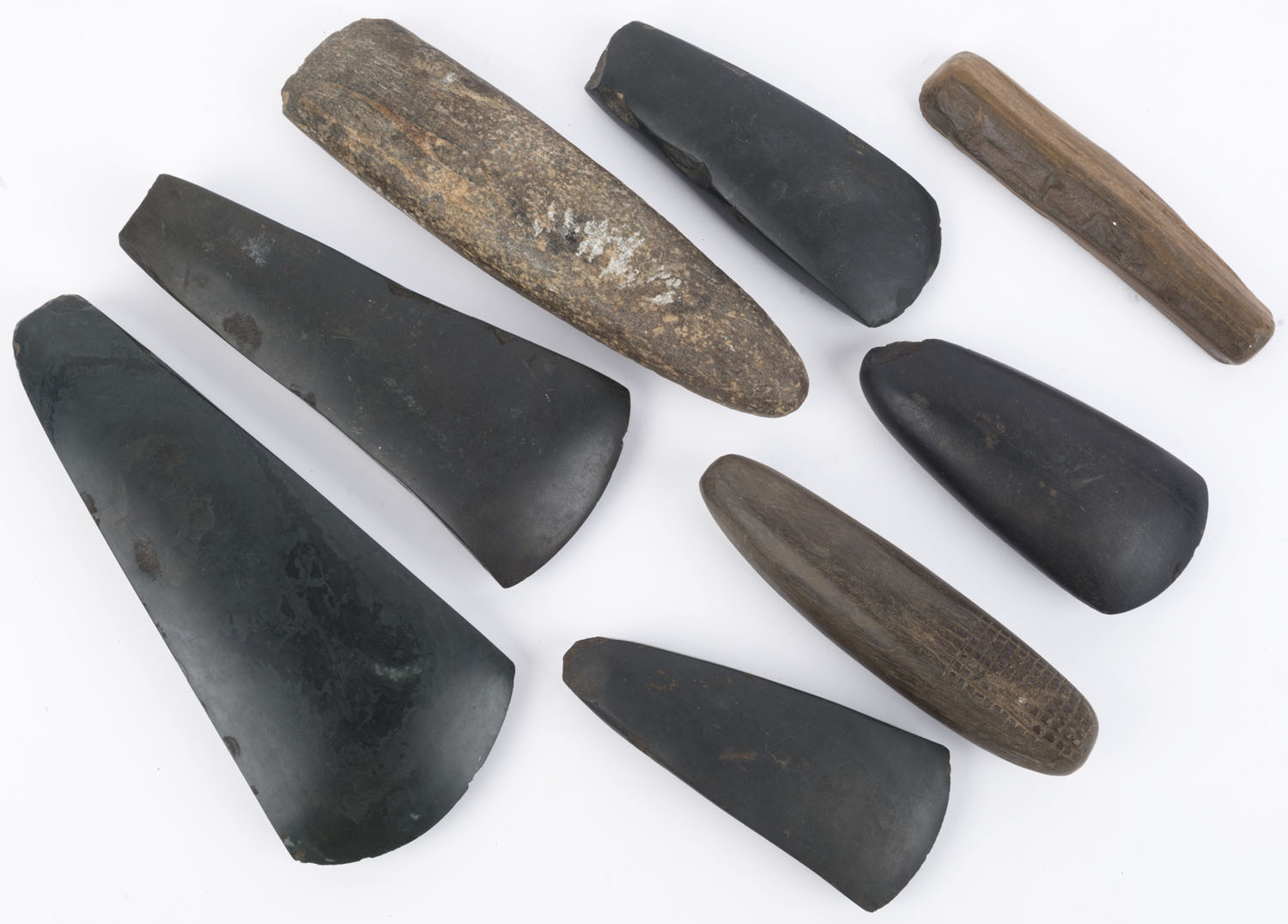 Group of eight assorted stone axe heads and tools, Papua New Guinea ...