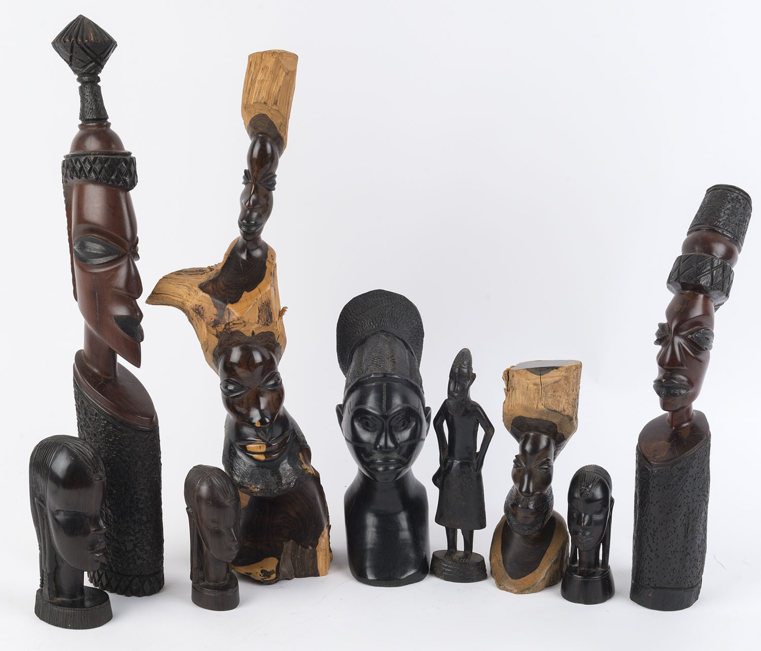 A group of nine assorted African tribal carvings, 20th century, the ...