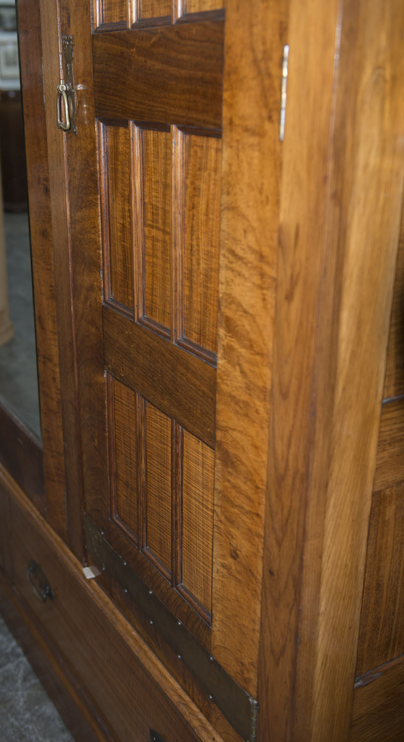 An Australian Arts & Crafts wardrobe, fiddleback blackwood with copper ...