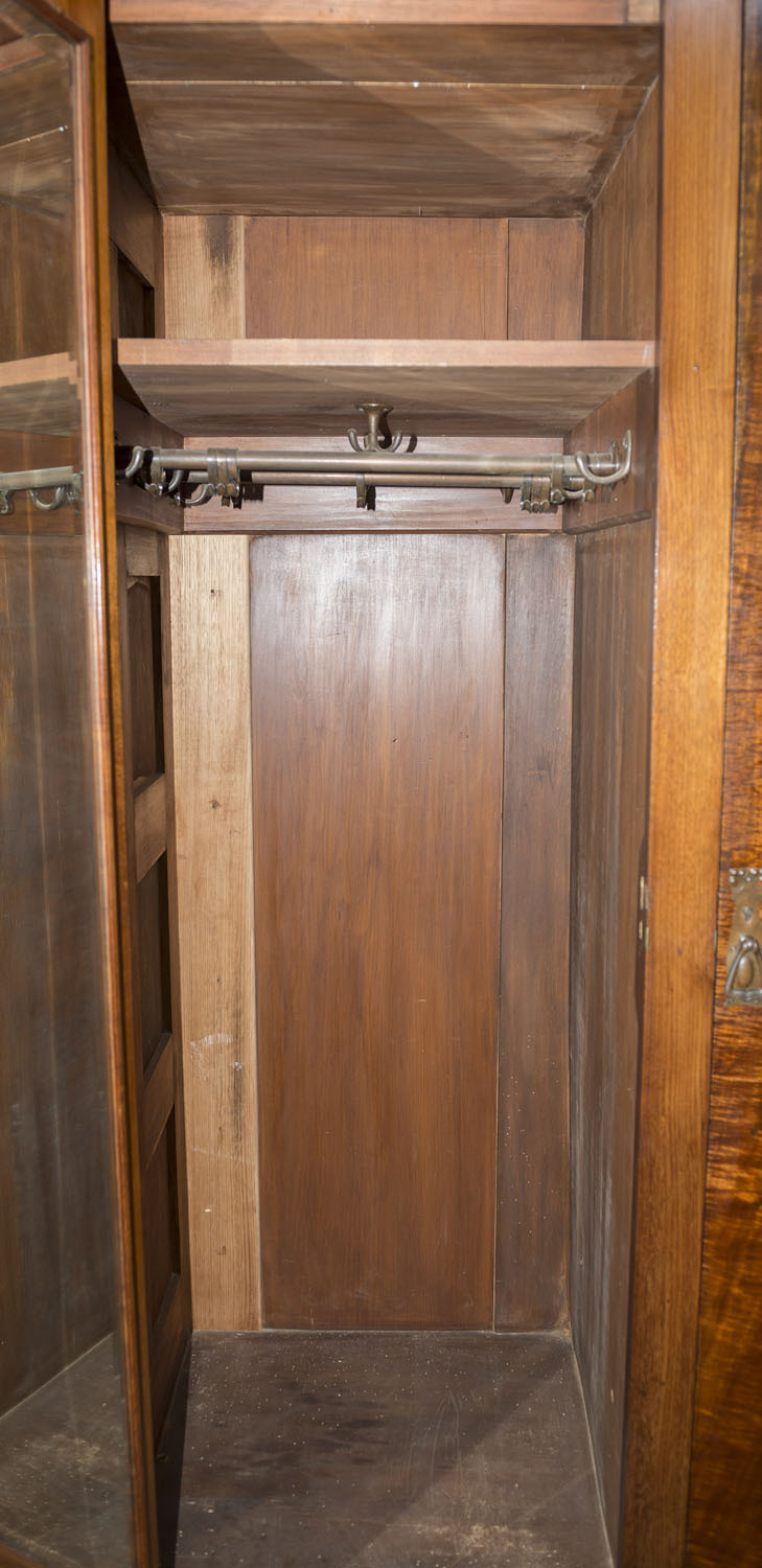 An Australian Arts & Crafts wardrobe, fiddleback blackwood with copper ...