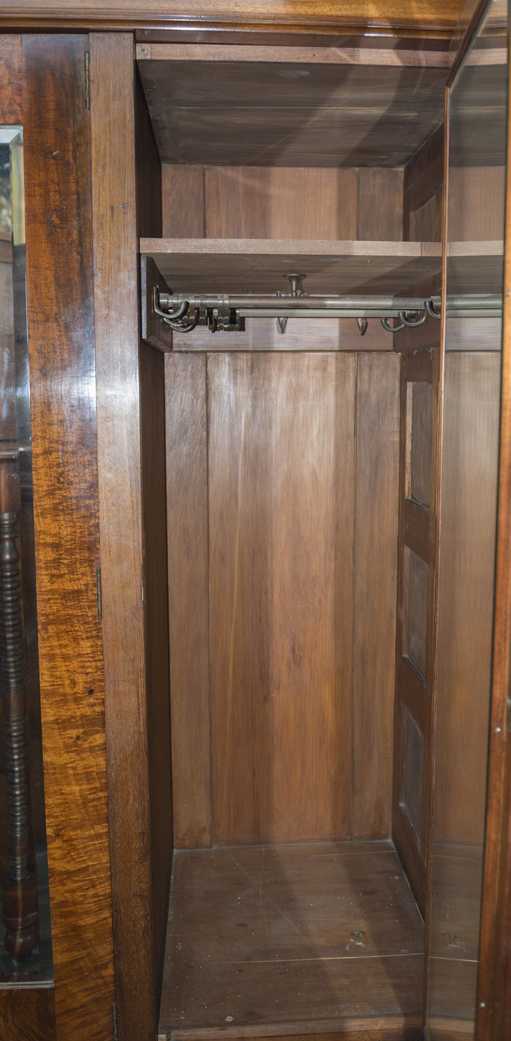 An Australian Arts & Crafts wardrobe, fiddleback blackwood with copper ...