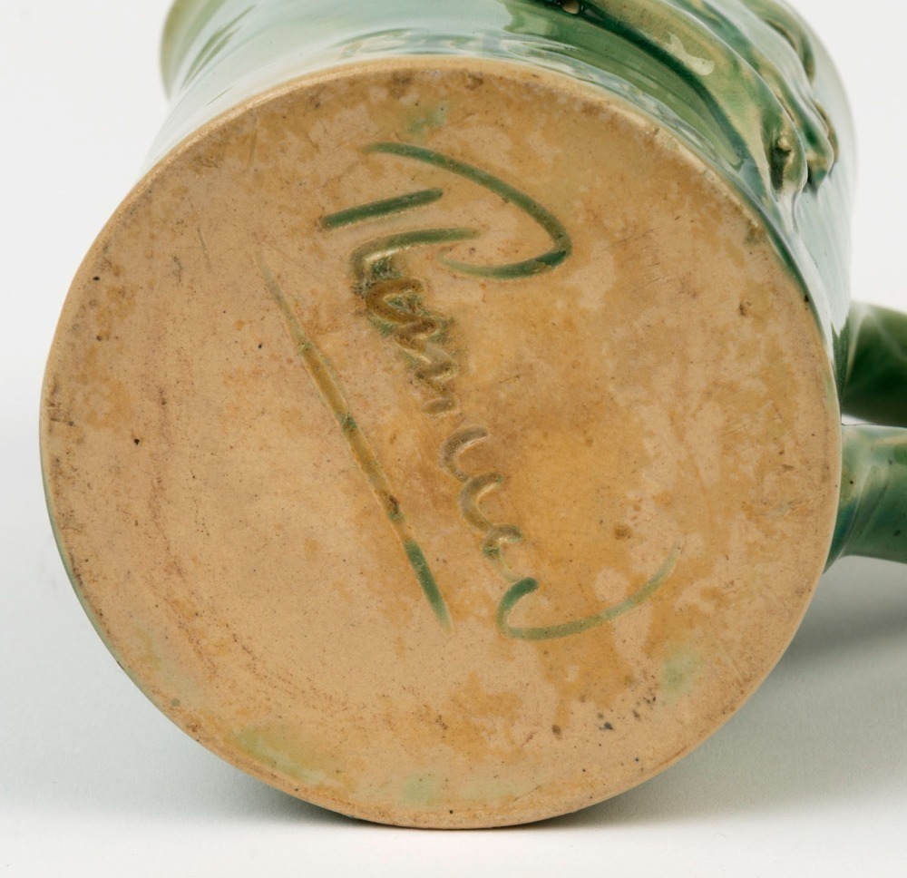 REMUED Batman, Melbourne Centenary green glazed pottery jug with ...