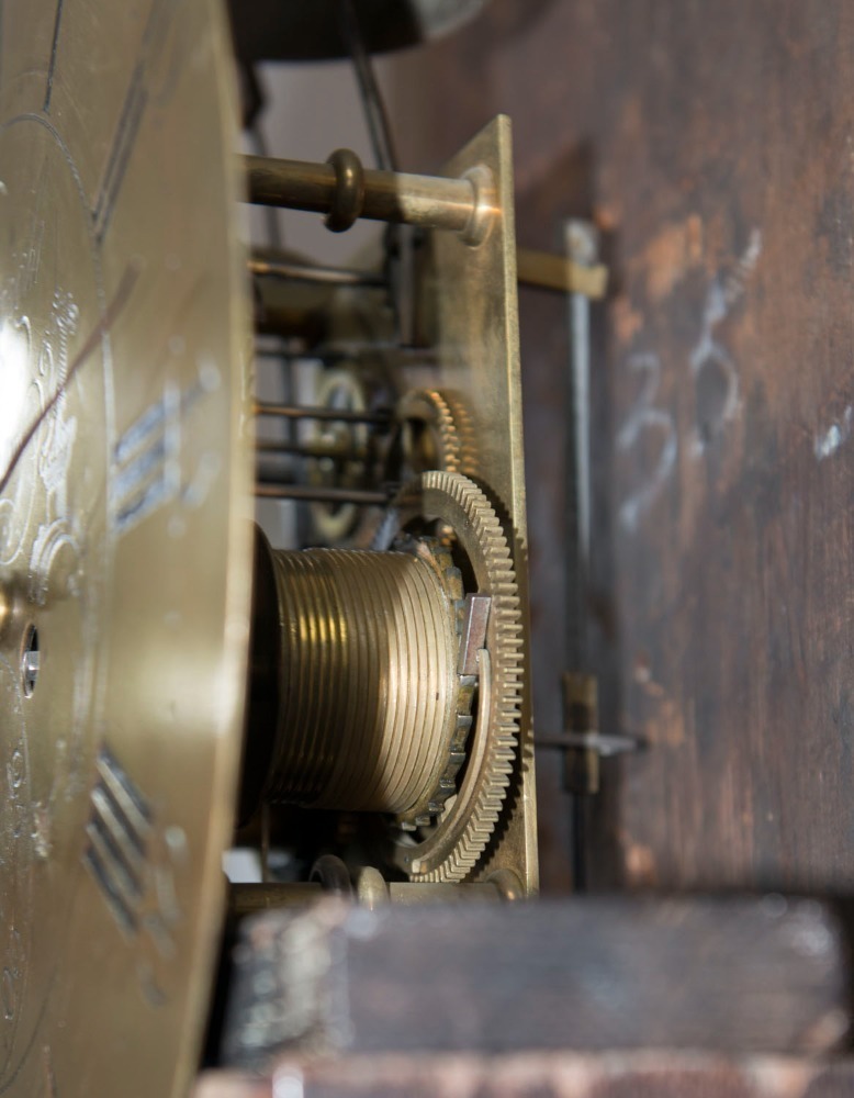 An antique English twin weight long-case grandfather clock with ...