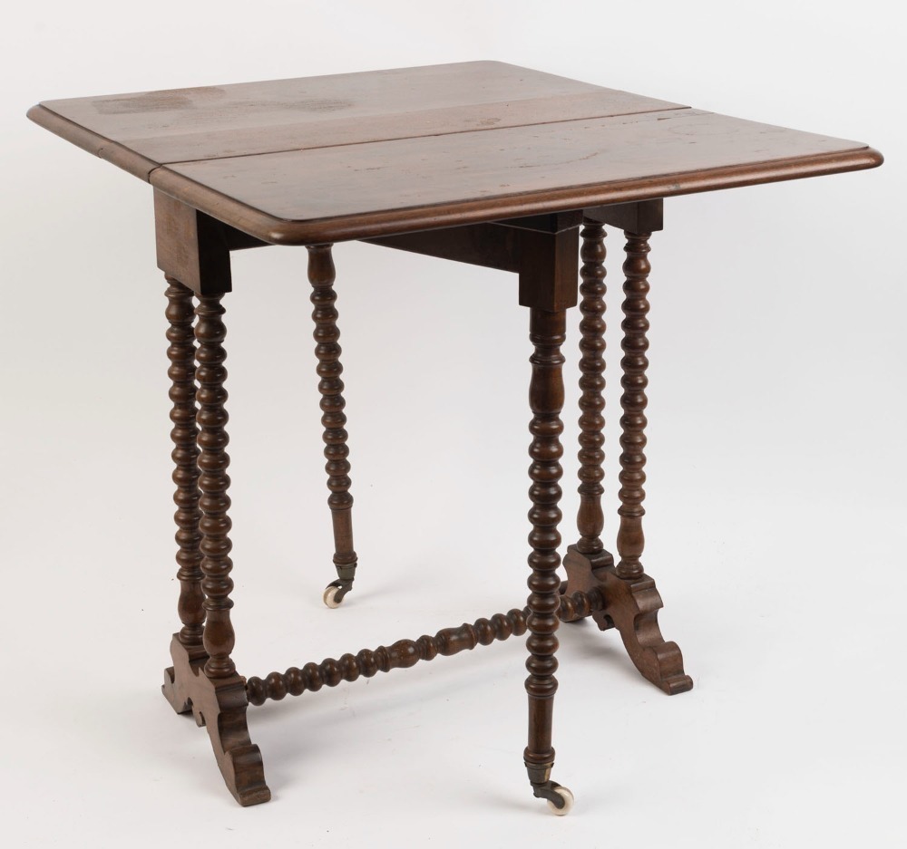 An antique English walnut Sutherland table with bobbin turnings and ...