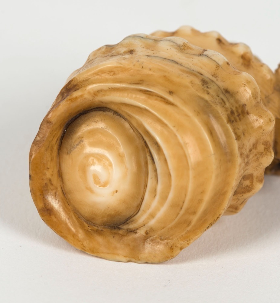 Three Japanese carved ivory netsuke in the form of a fox, man with ...