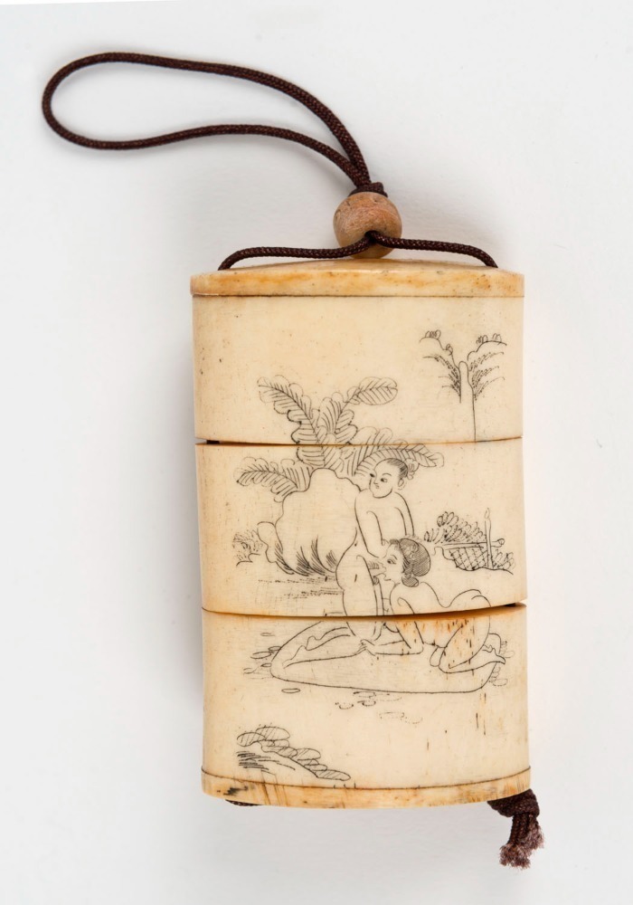 A Japanese carved bone inro engraved with erotic scenes, 20th century ...