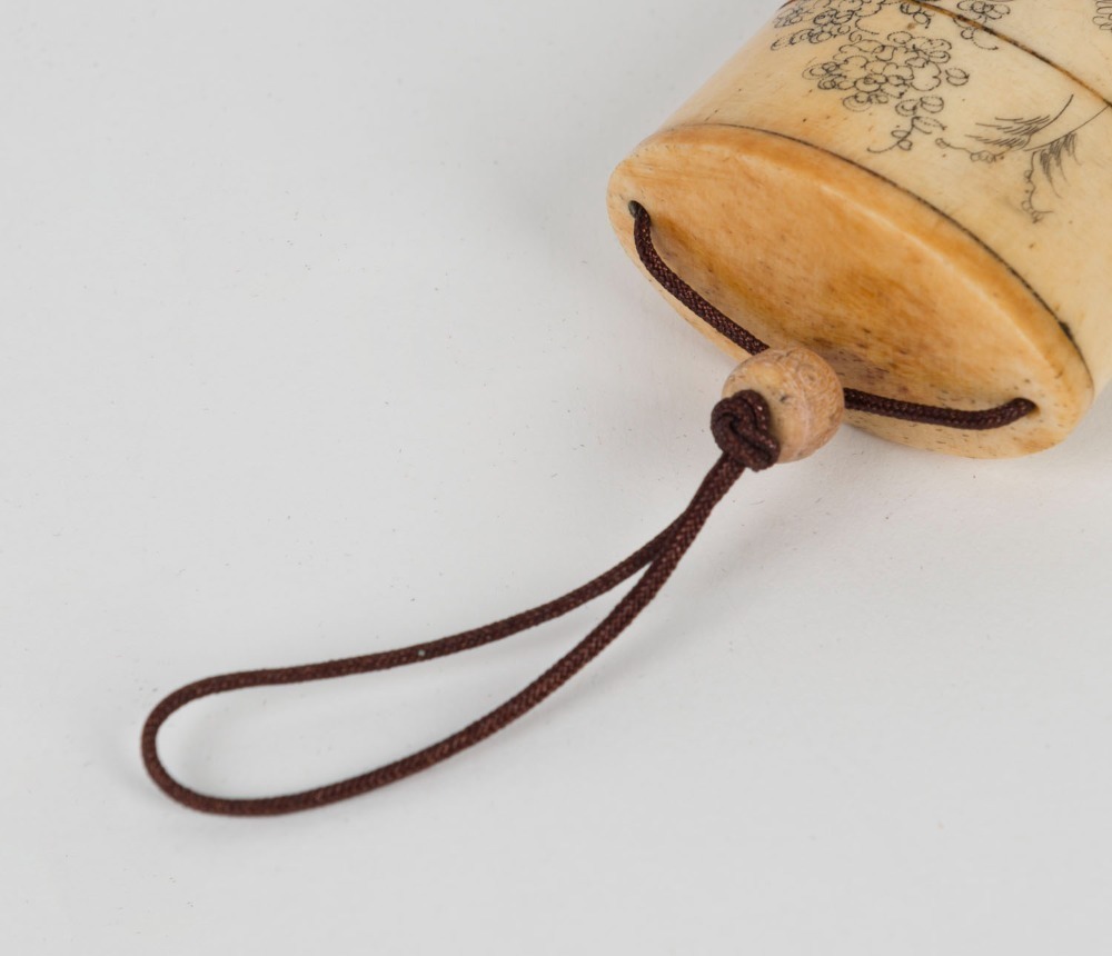 A Japanese carved bone inro engraved with erotic scenes, 20th century ...