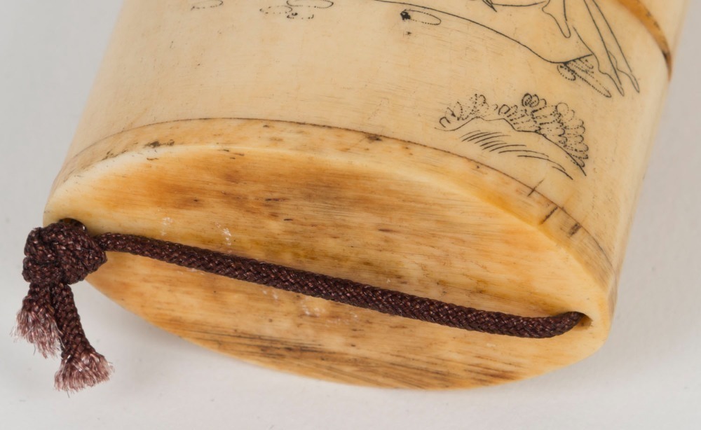 A Japanese carved bone inro engraved with erotic scenes, 20th century ...