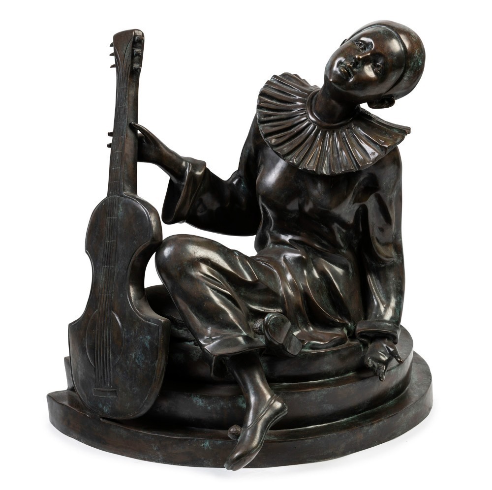 An impressive vintage cast bronze figure of a female pierrot crossed ...