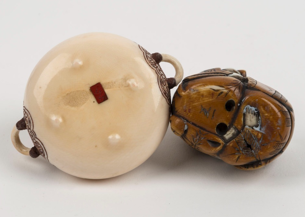 A Japanese ivory netsuke with stained finish, together with a Japanese ...