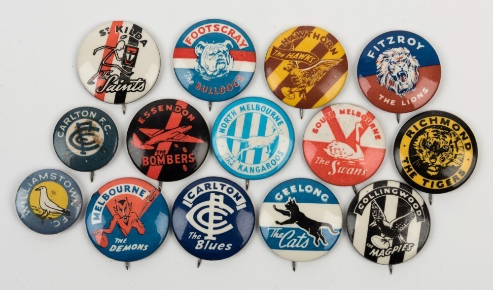 A collection of 1960s Herald Footy badges featuring one of each of the ...