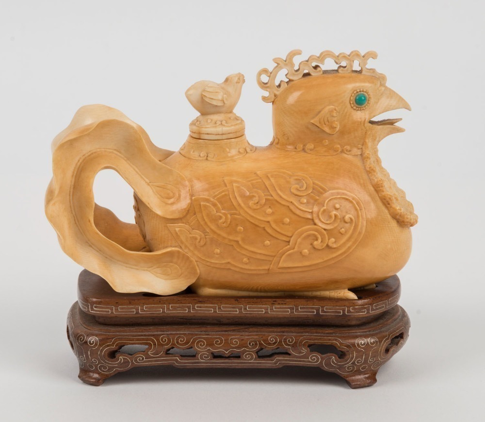 A Chinese carved ivory bird water dropper, on inlaid and carved timber ...
