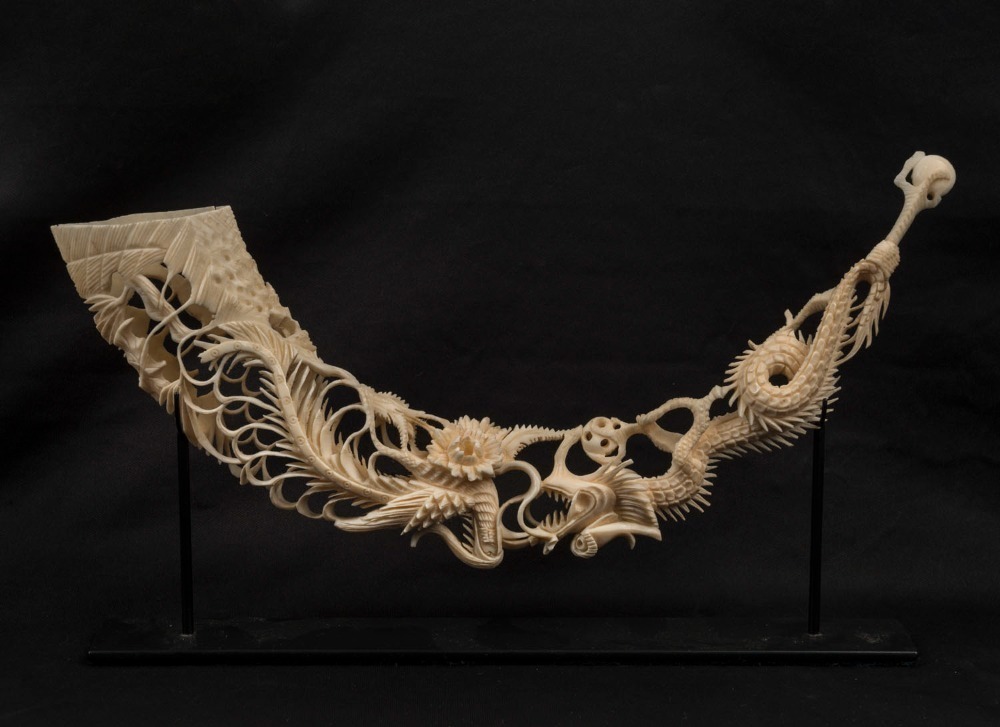 An antique Chinese carved hippo tooth dragon and phoenix flaming pearl ...