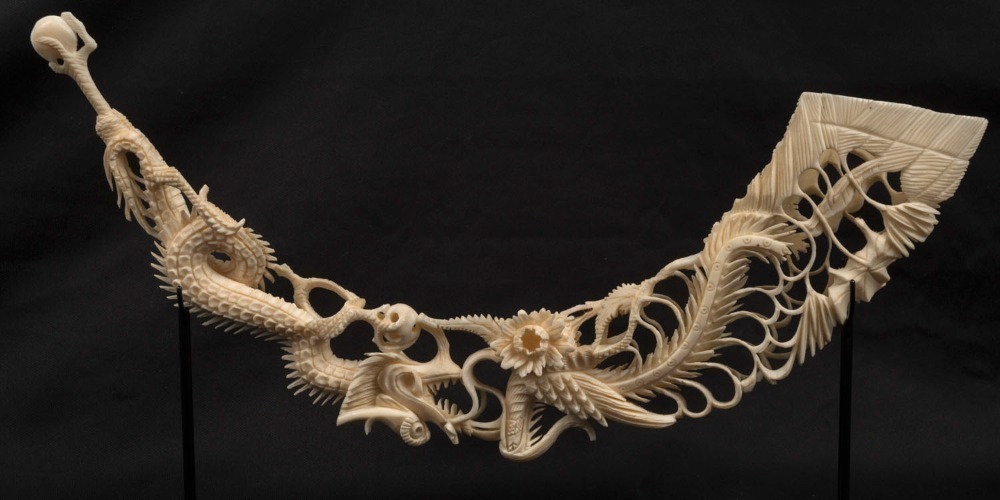 An antique Chinese carved hippo tooth dragon and phoenix flaming pearl ...