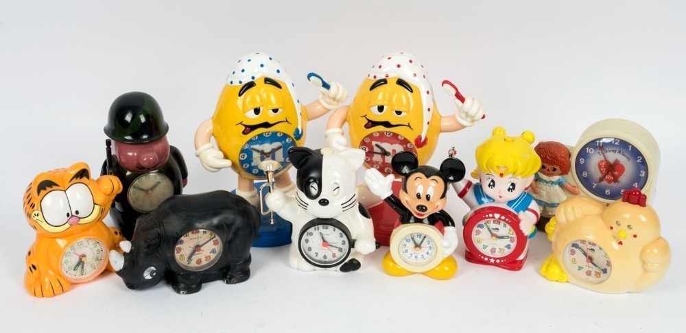 Ten assorted novelty talking alarm clocks in plastic cases, including ...