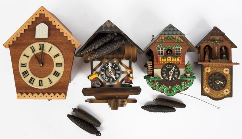 Four vintage German weight driven Black Forest Cuckoo clocks, one with ...
