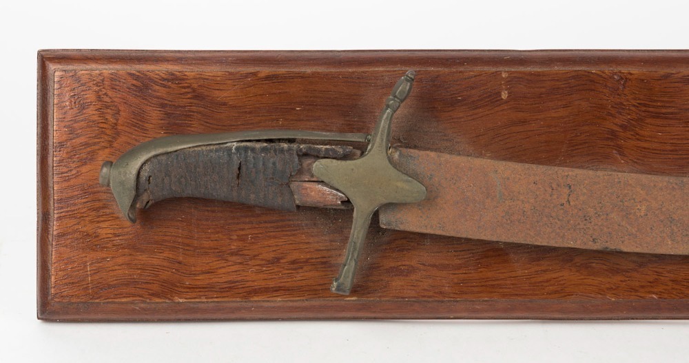 COLONIAL OFFICER'S SWORD relic condition, mounted on board with plaque ...