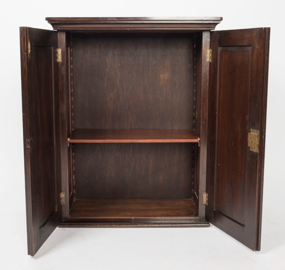 An unusual kauri pine cupboard with daisy-moulded panelled doors ...