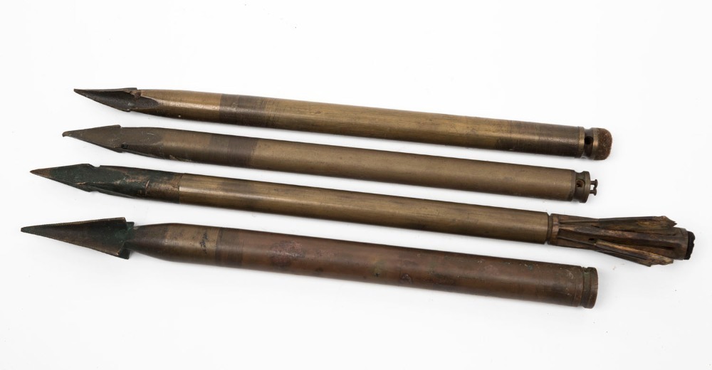 BOMB LANCERS selection of four brass examples, one with wings, early ...