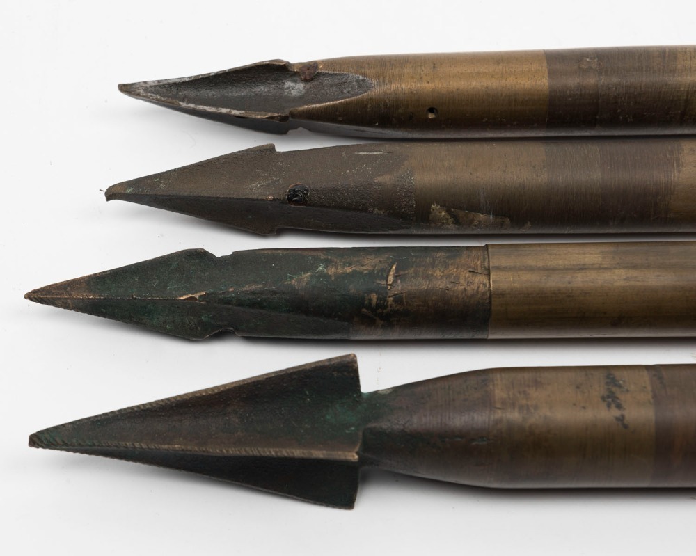BOMB LANCERS selection of four brass examples, one with wings, early ...