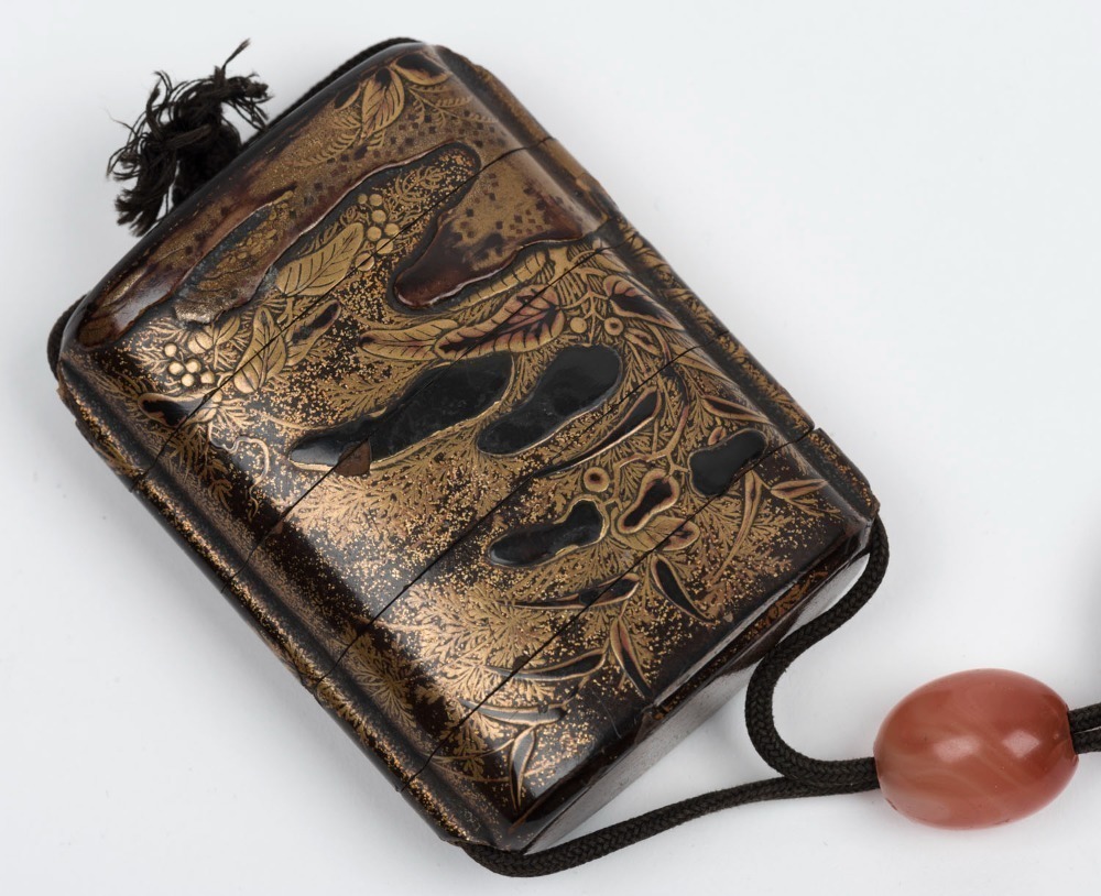 An antique Japanese Urushi lacquer inro with gold leaf maki, adorned ...
