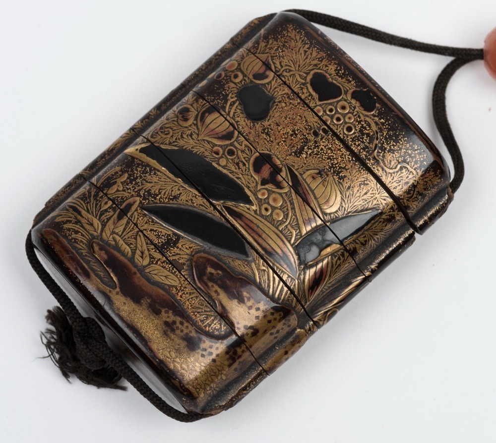 An antique Japanese Urushi lacquer inro with gold leaf maki, adorned ...