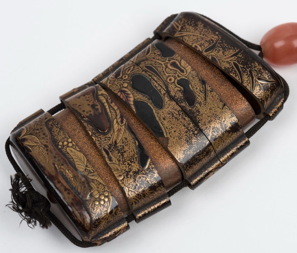 An antique Japanese Urushi lacquer inro with gold leaf maki, adorned ...