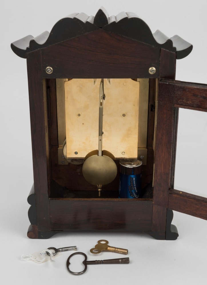 An antique English William IV four glass library clock in rosewood and ...