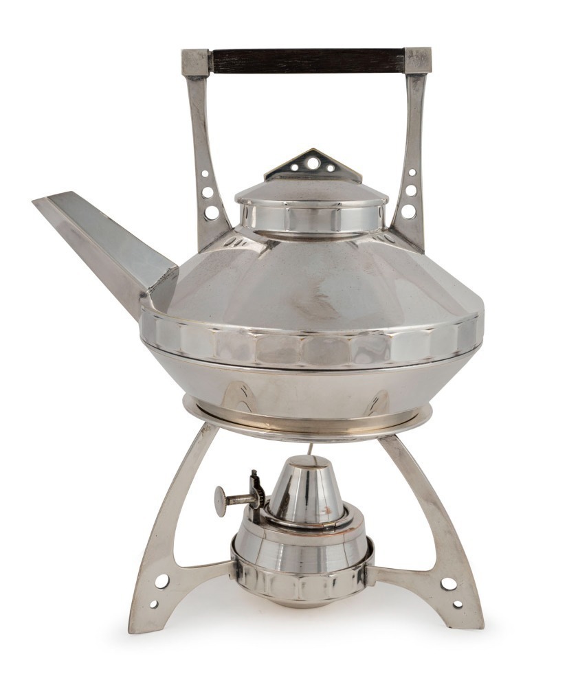 A chromium plated UFO teapot with ebonised handle, original stand and ...
