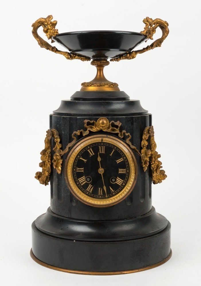 An antique French urn shaped mantle clock, black slate with ormolu ...