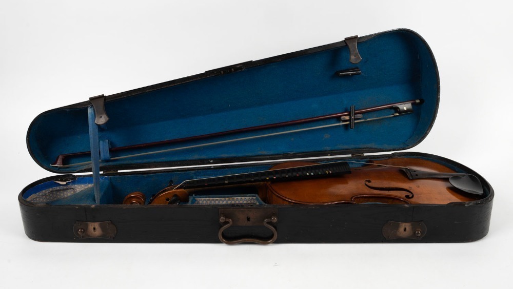 A vintage German violin and bow in case bearing Stradivarius label ...