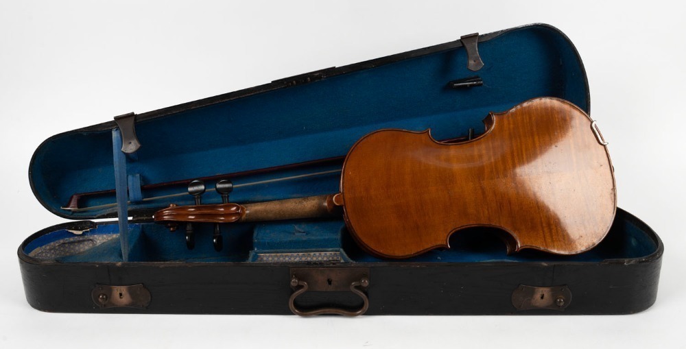 A vintage German violin and bow in case bearing Stradivarius label ...