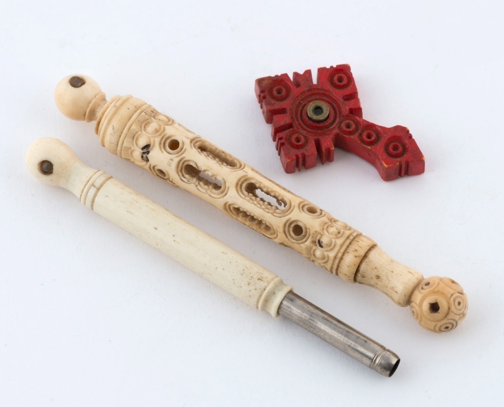 STANHOPES group of three antique bone and ivory examples, one with red ...