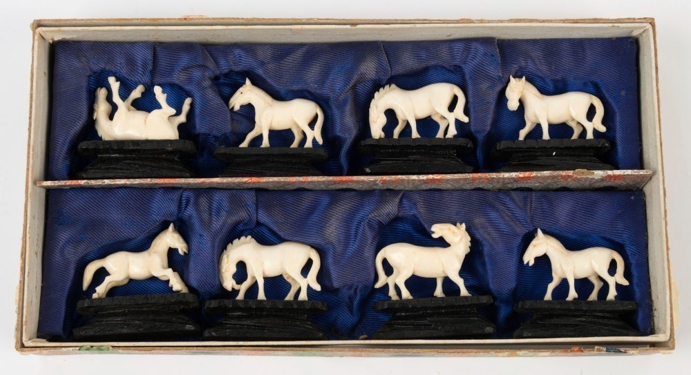 A set of eight Chinese carved ivory horse statues on carved wooden ...