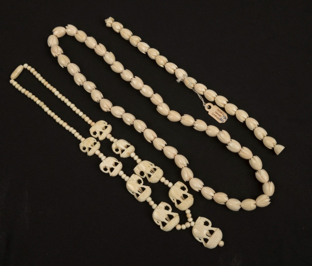 Two vintage carved ivory necklaces and a carved ivory bracelet, mid ...