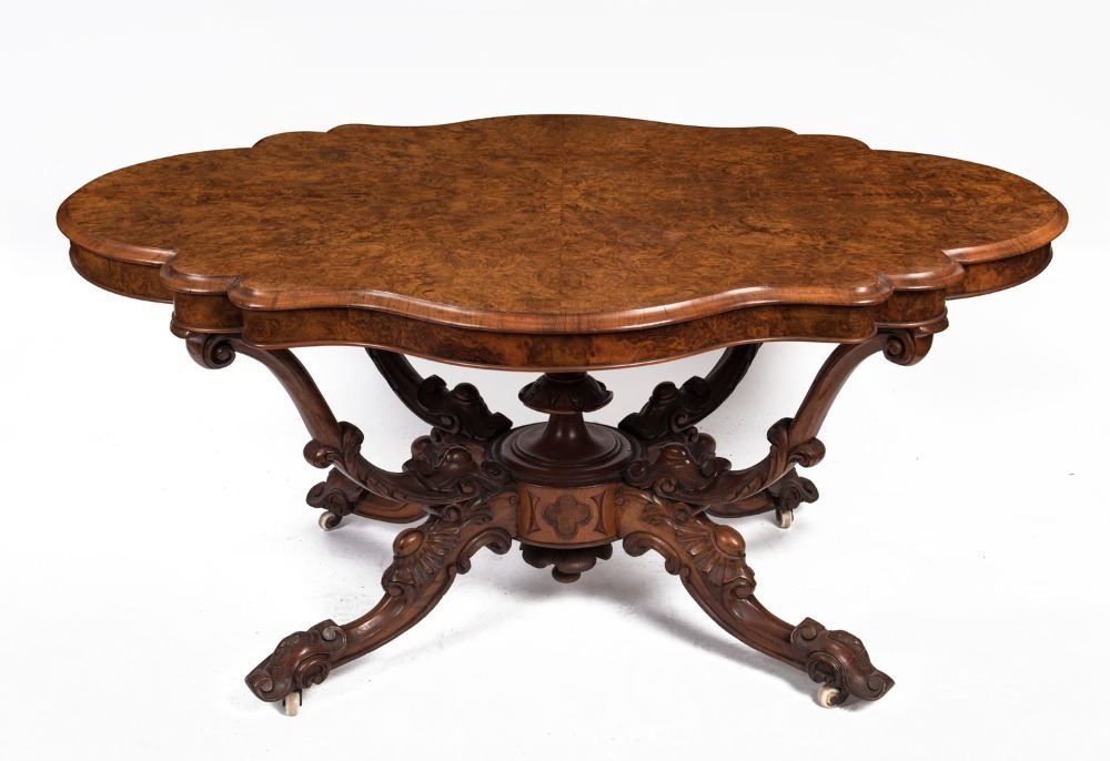 A fine antique English burr walnut centre table with handsome quarter ...