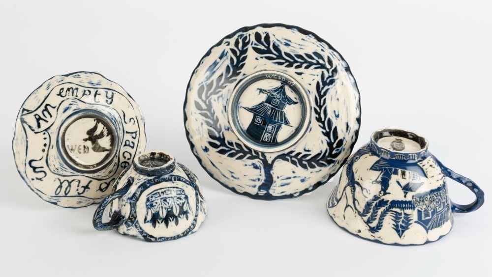 GERRY WEDD, two blue and white ceramic cups and saucers with hand ...