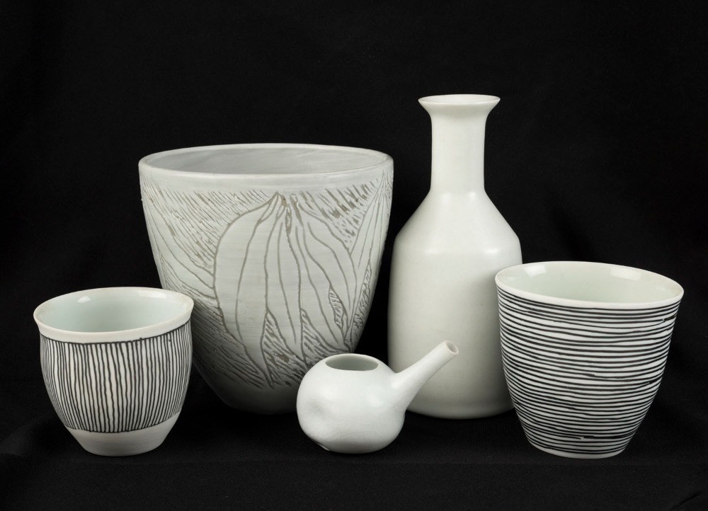 HILLARY JONES cream ceramic bottle vase, a gum leaf vase, two cream ...