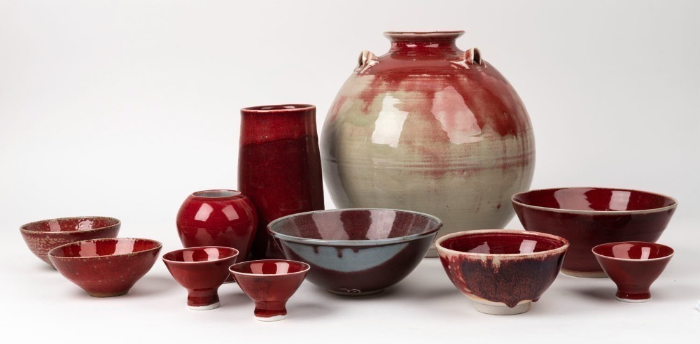 Eleven assorted Australian studio pottery bowls and vases with sang-de ...