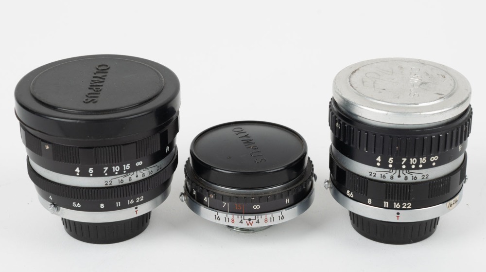 OLYMPUS: Three lenses in black and chrome with bayonet mounts for ...