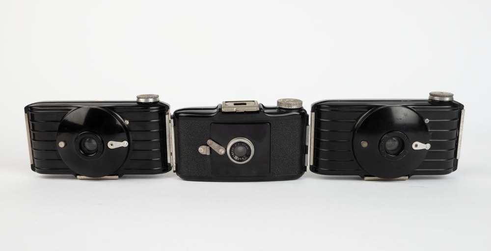 KODAK: Three black Bakelite cameras - one c. 1936 Bullet, one c. 1936 ...
