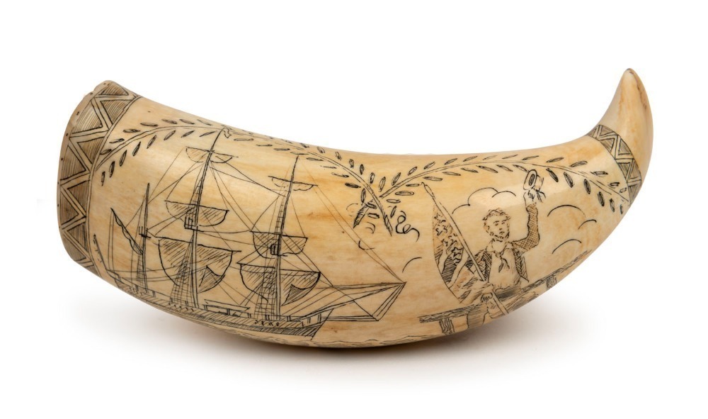 A scrimshaw whale's tooth titled The Sailor's Return , engraved with a ...