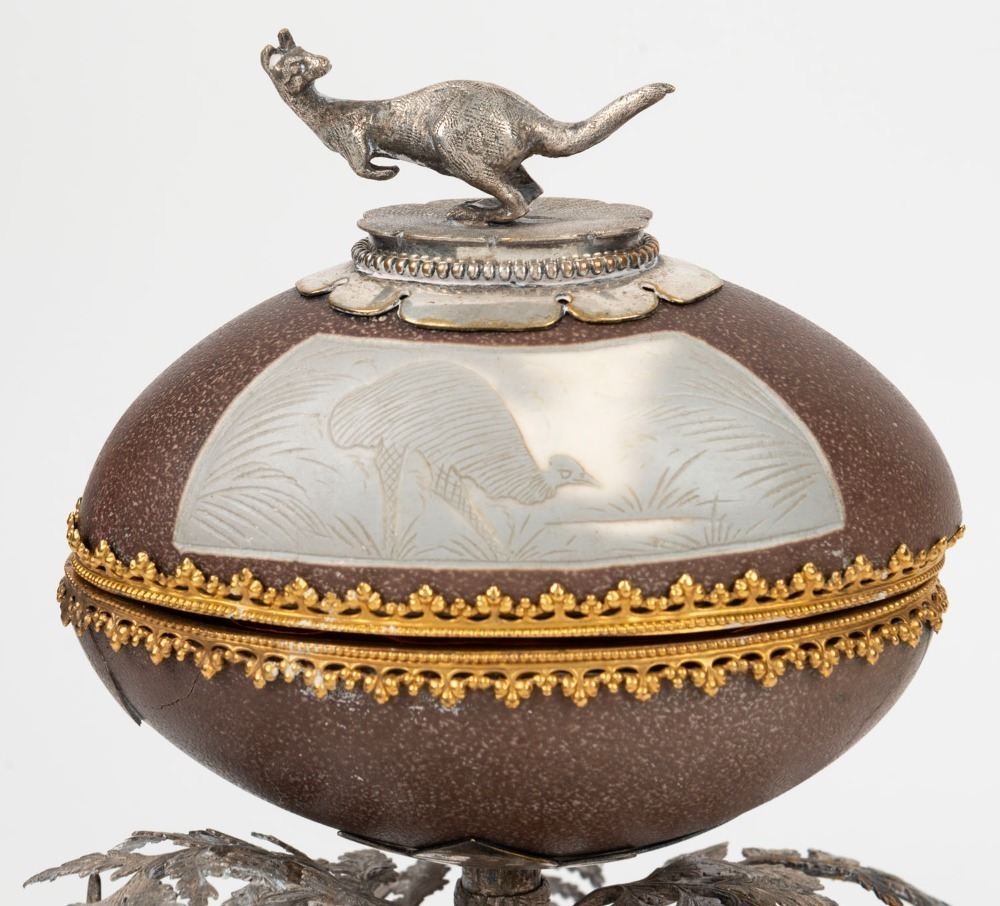 An antique Australian silver mounted emu egg casket decorated with an ...