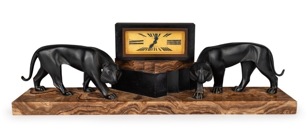 A fine French Art Deco mantle clock with bronze panther statue ...