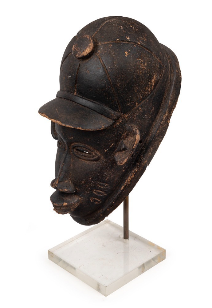 Colon mask, carved wood with patinated finish, West African origin with ...