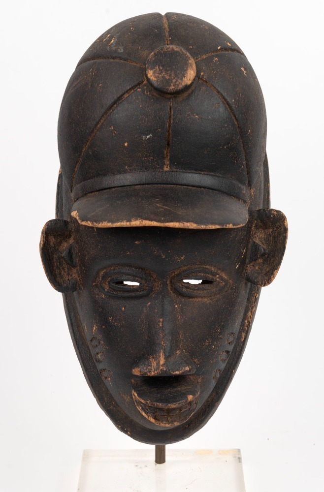 Colon mask, carved wood with patinated finish, West African origin with ...