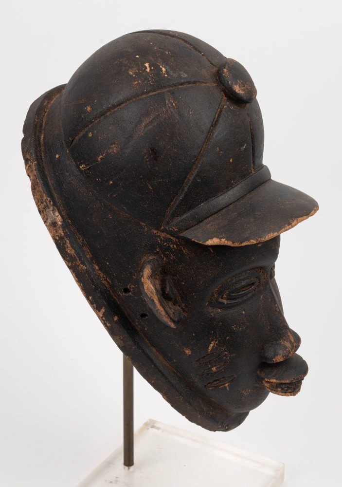 Colon mask, carved wood with patinated finish, West African origin with ...